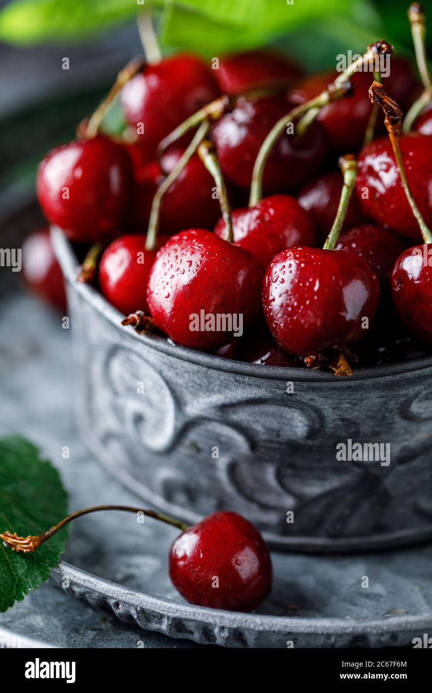 Fresh sweet cherries on table with water drops. Cherry background. Food ...