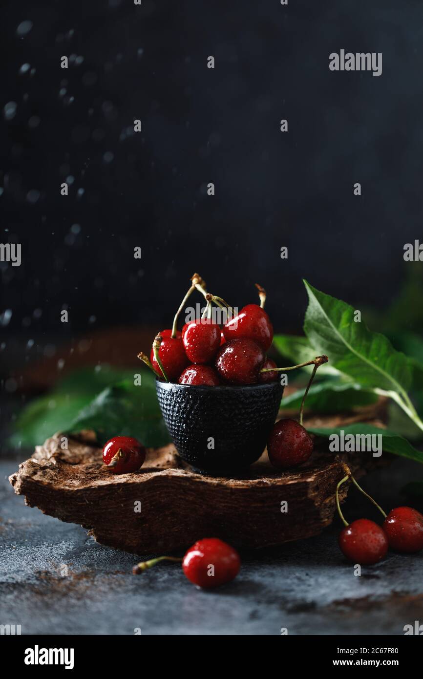 Fresh sweet cherries on table with water drops. Cherry background. Food ...