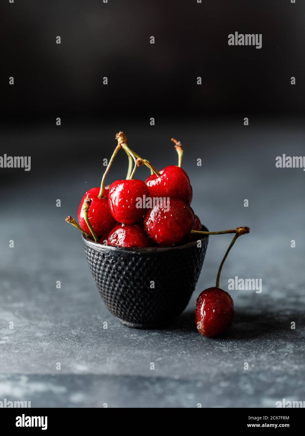 Fresh sweet cherries on table with water drops. Cherry background. Food ...