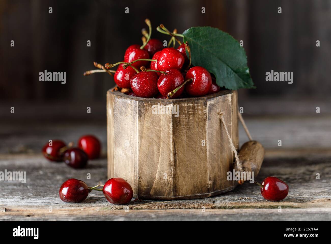 Fresh sweet cherries on table with water drops. Cherry background. Food ...