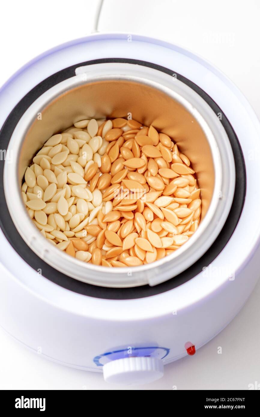 Wax depilation heating hi-res stock photography and images - Alamy