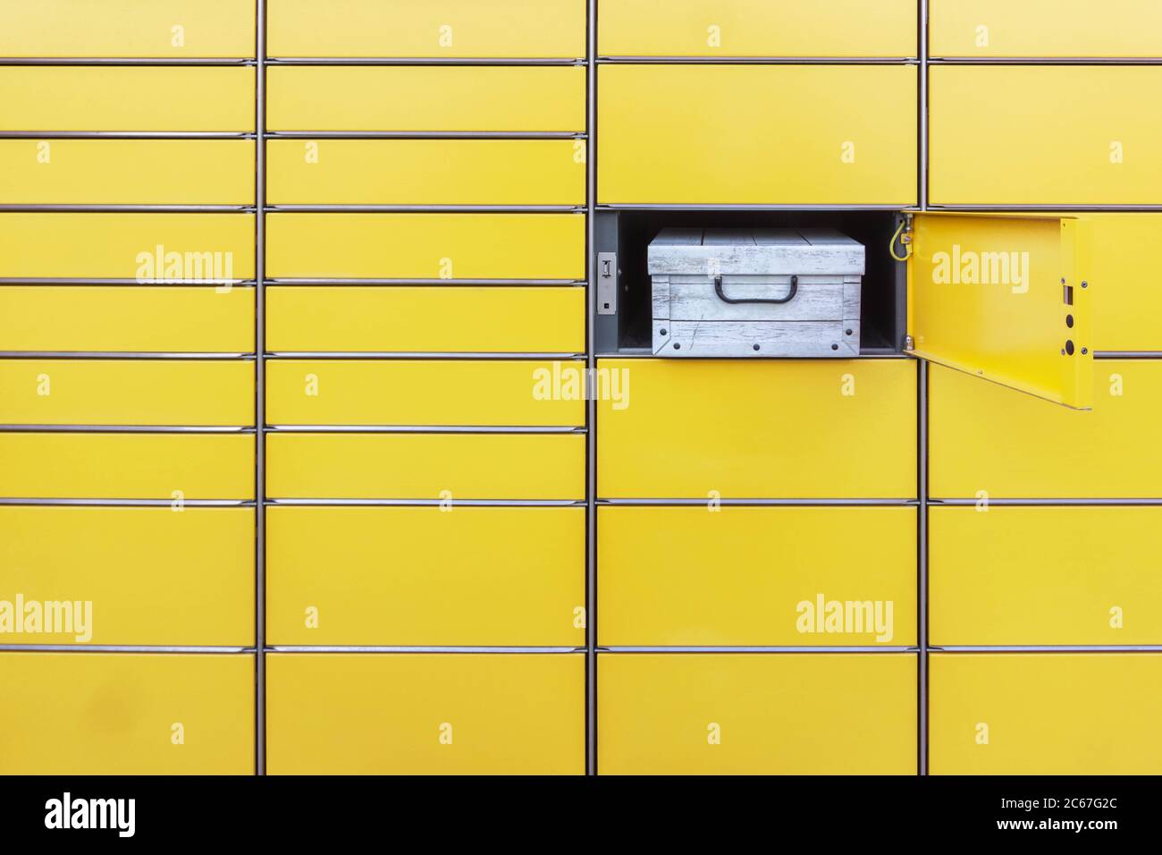 Received parcel in open box of automated self-service post terminal ...