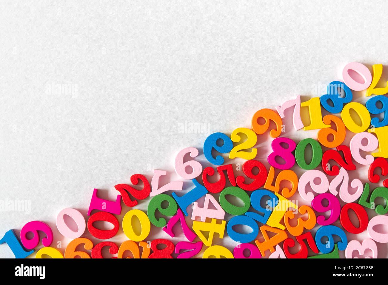Colorful wooden numbers on part of background with copy space. Numbers ...