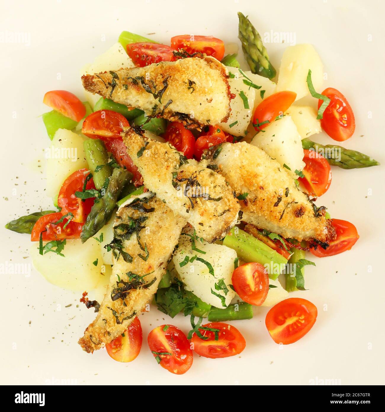 Healthy food concept. Fresh salad with red gurnard fish fillets gratin ...