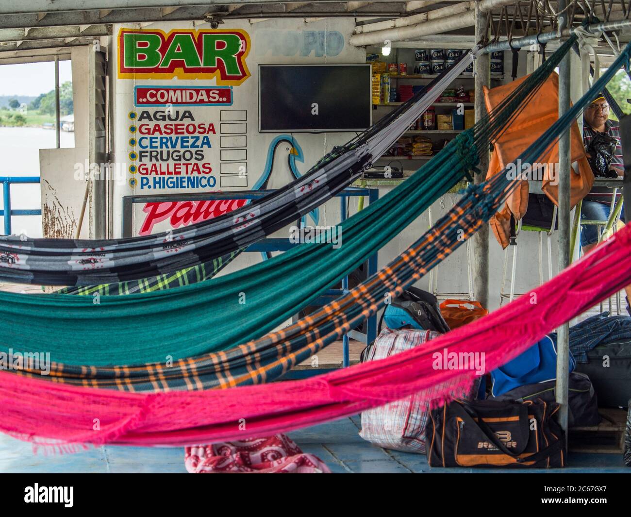 Amazon River, Peru. Beautiful, colorful hammocks on the cargo boat ...