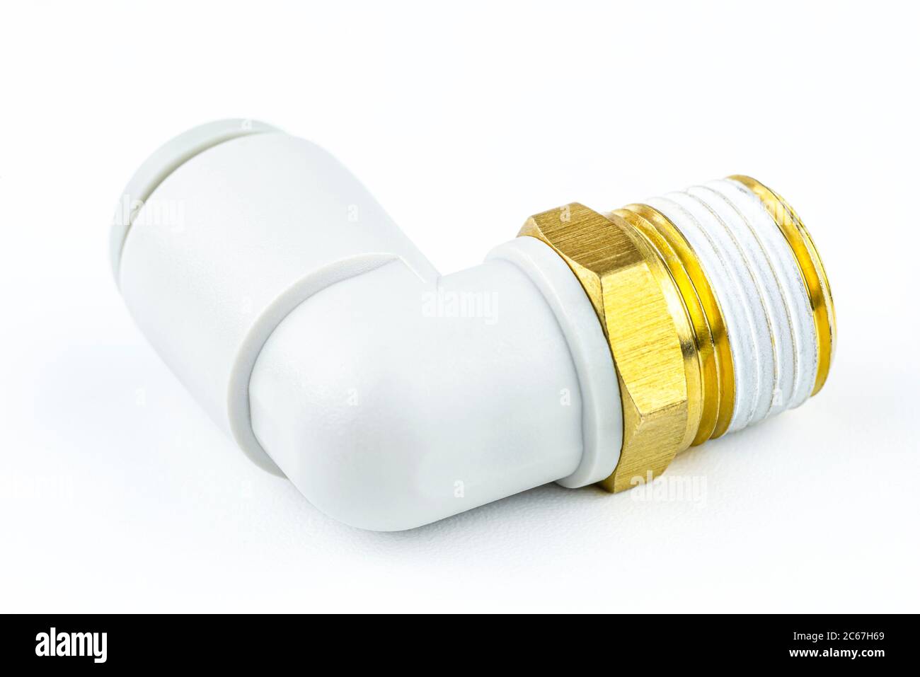 Macro shot of a white, pneumatic elbow fitting for a plastic tube with ...