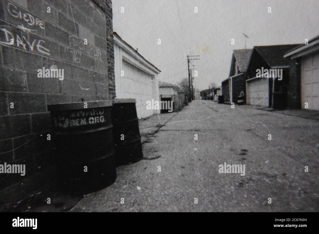 Fine 70s vintage black and white lifestyle photography of an urban back ...