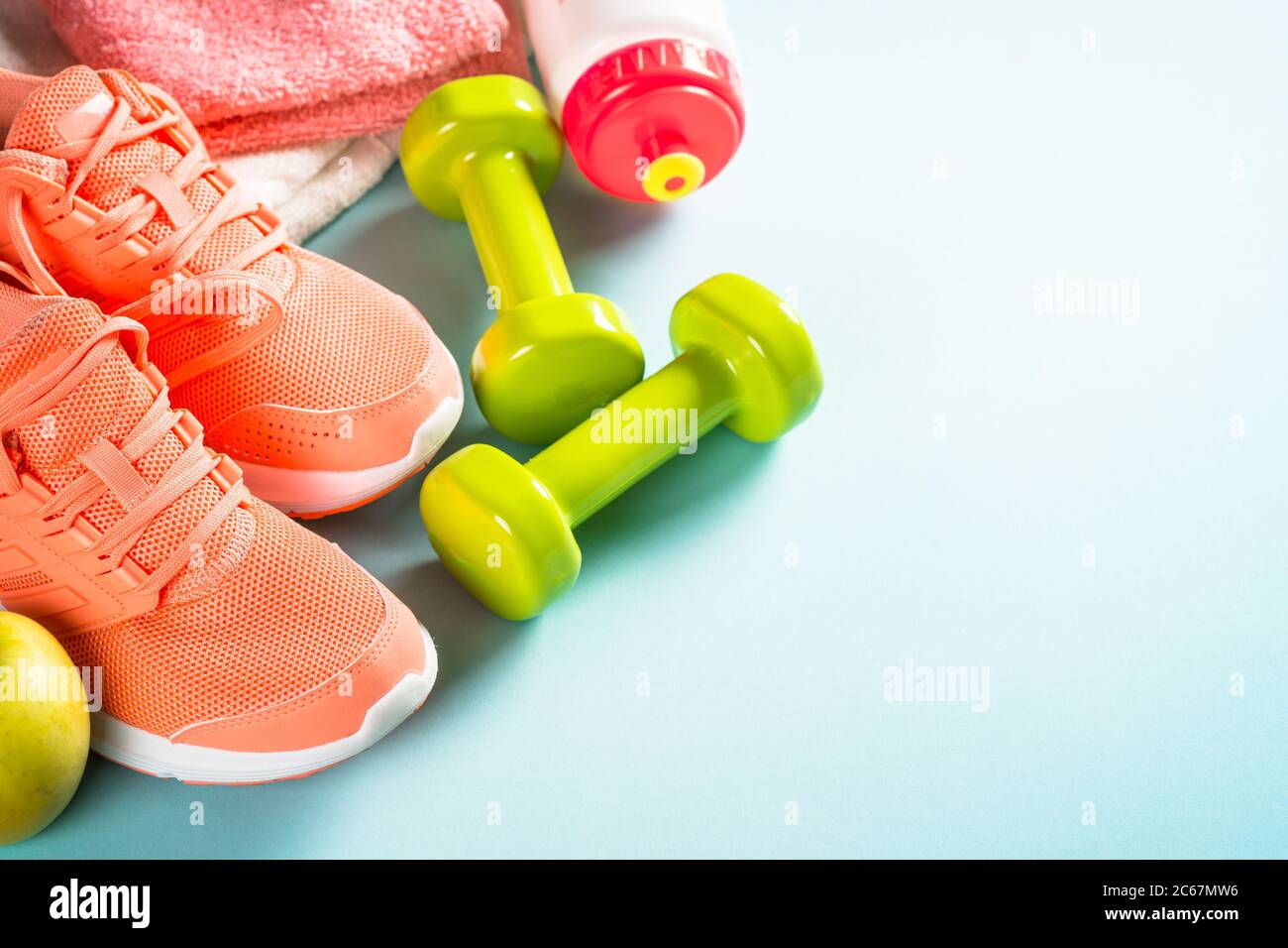 Fitness equipment at blue background top view Stock Photo - Alamy