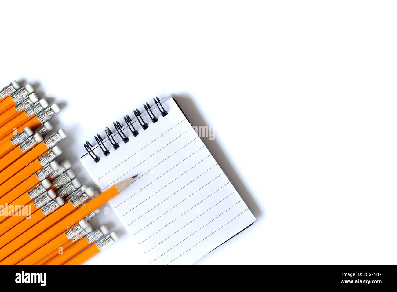 Stationery flat lay. Weekly organizer planner, sharp pencil surrounded ...