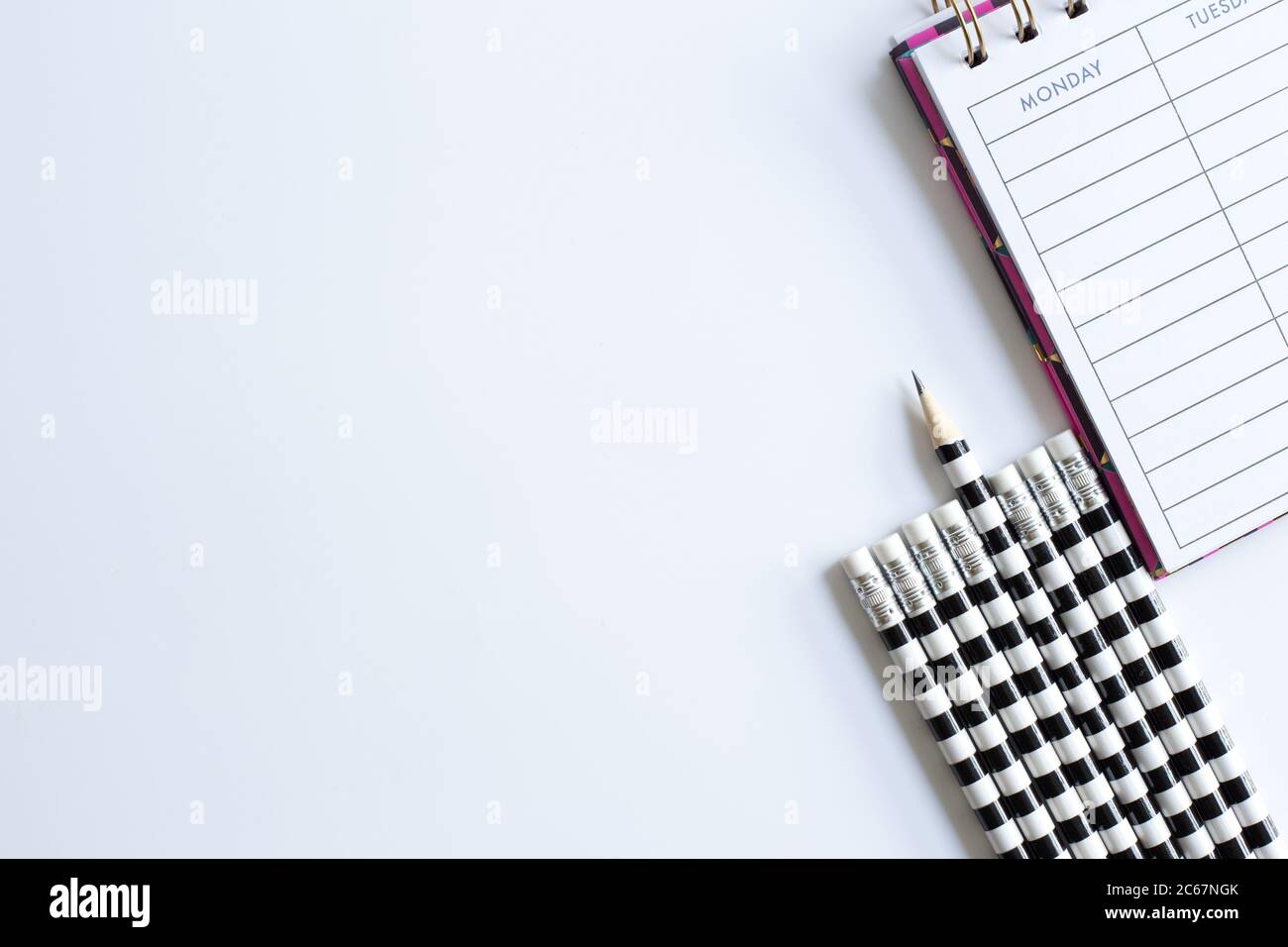 Weekly organizer planner, shaper and sharp pencil surrounded by dull ...