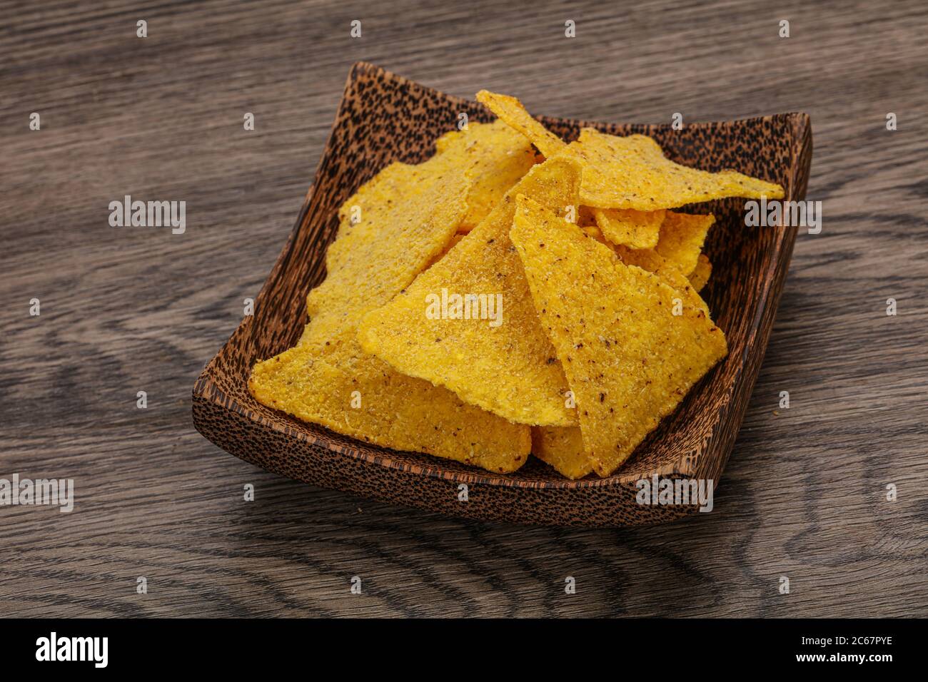 Mexican crunchy corn nachos triangle heap Stock Photo - Alamy