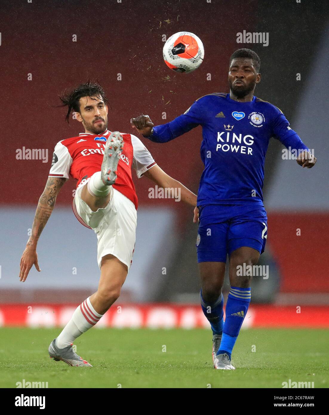 Arsenal's Dani Ceballos (left) and Leicester City's Kelechi Iheanacho ...