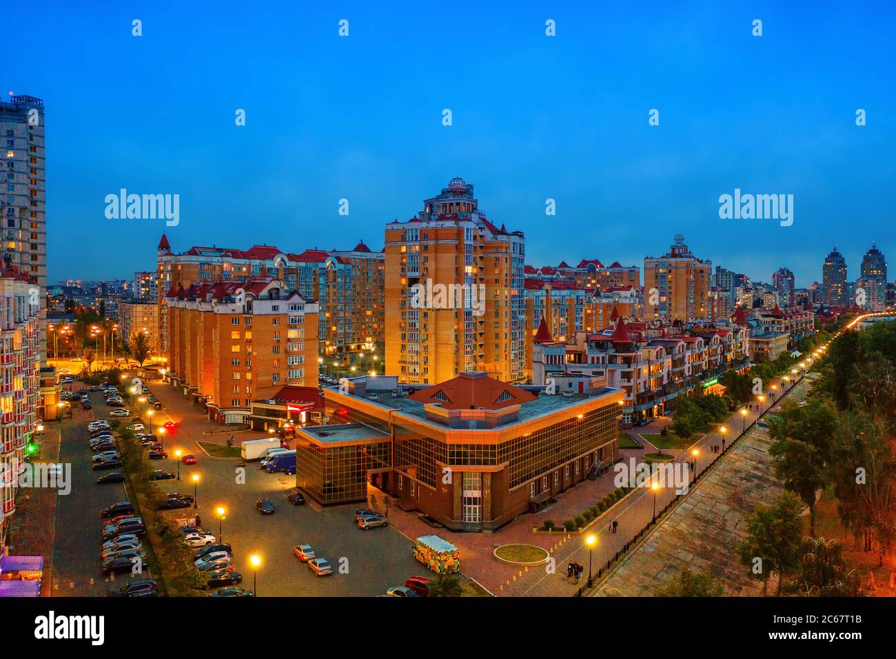 Night aerial view on Obolon area of Kyiv city with illumination. Flying ...