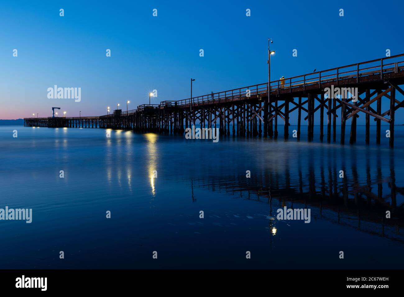 Illuminated Goleta Beach Pier at dusk, California, USA Stock Photo - Alamy