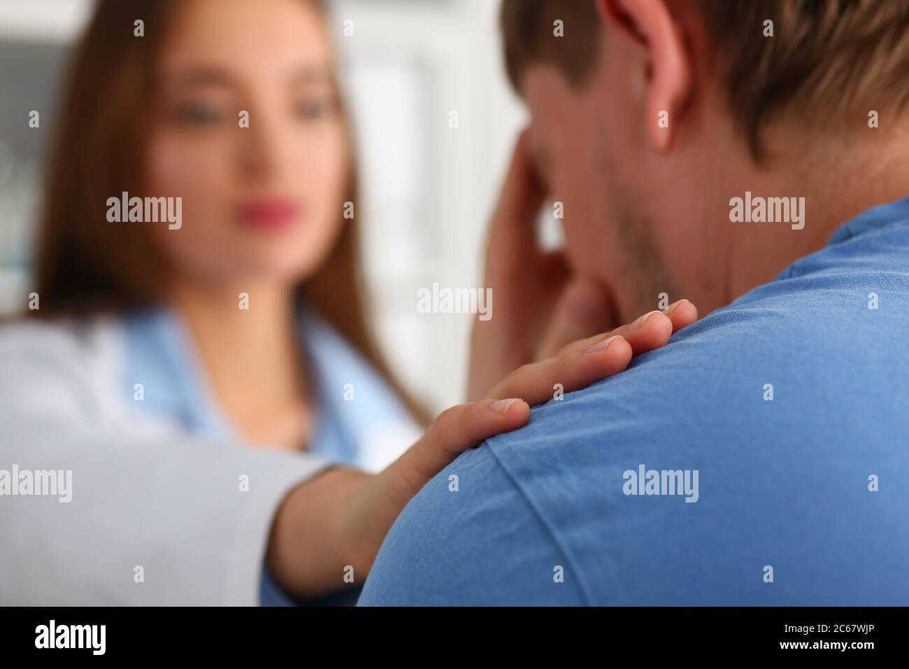 Male patient visiting his doctor the clinic Stock Photo - Alamy