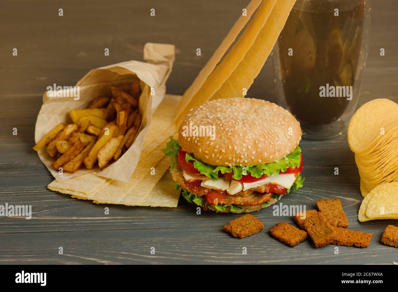 Delicious hamburger with fries, snacks and chips. Mix of snacks. Yummy ...