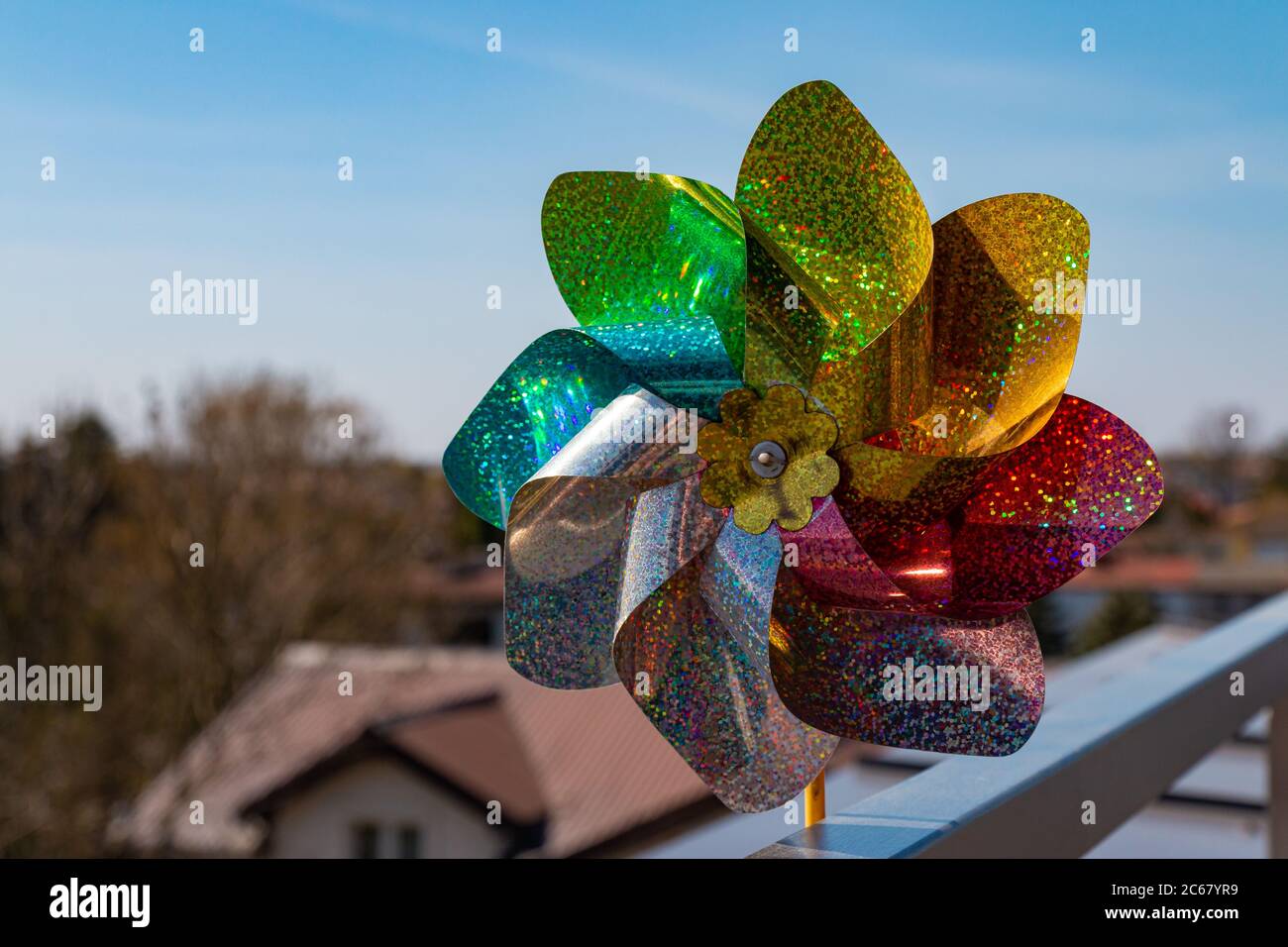 Multicolor pinwheel reflecting sun Stock Photo - Alamy