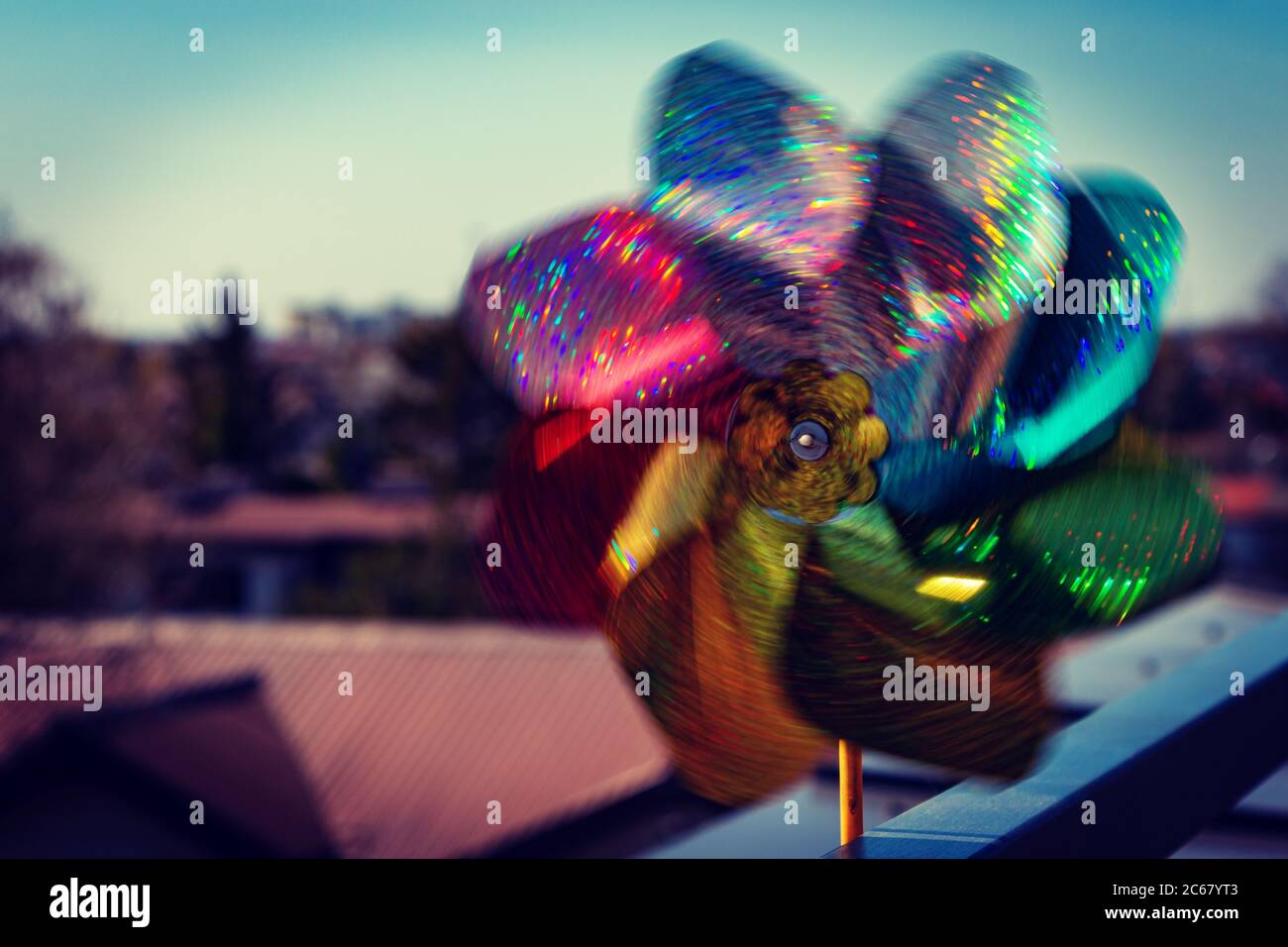 Spinning multicolor pinwheel reflecting sun Stock Photo - Alamy