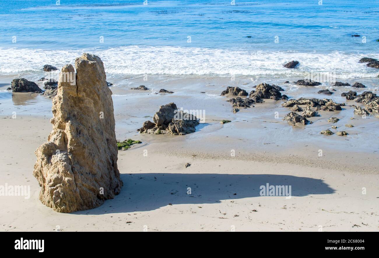 jagged rock formation on the Pacific shoreline at El Matador beach in ...