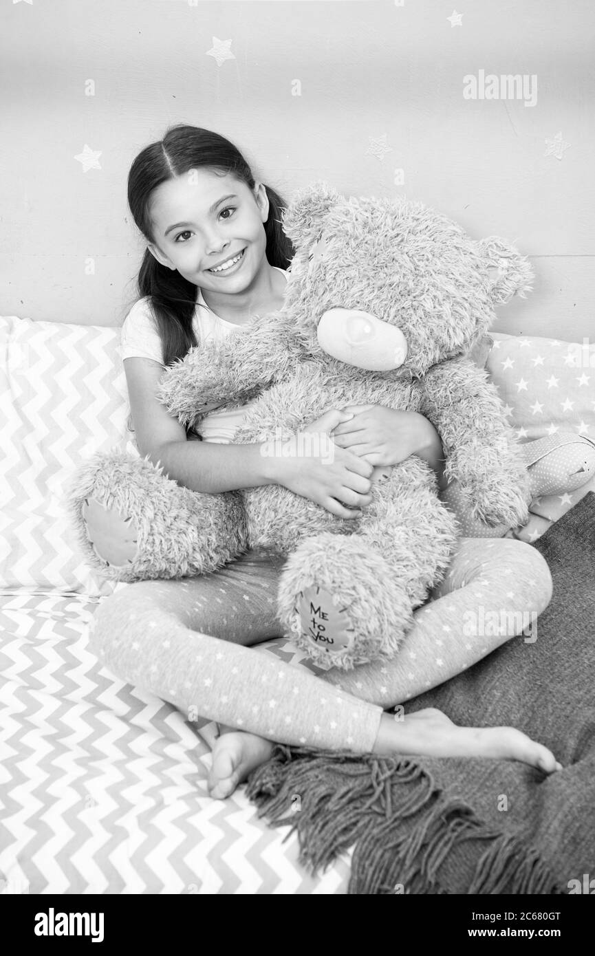 Create kids playground at home. Happy girl play with teddy bear ...