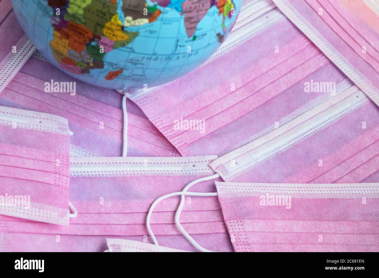 Globe with protection mask hi-res stock photography and images - Alamy