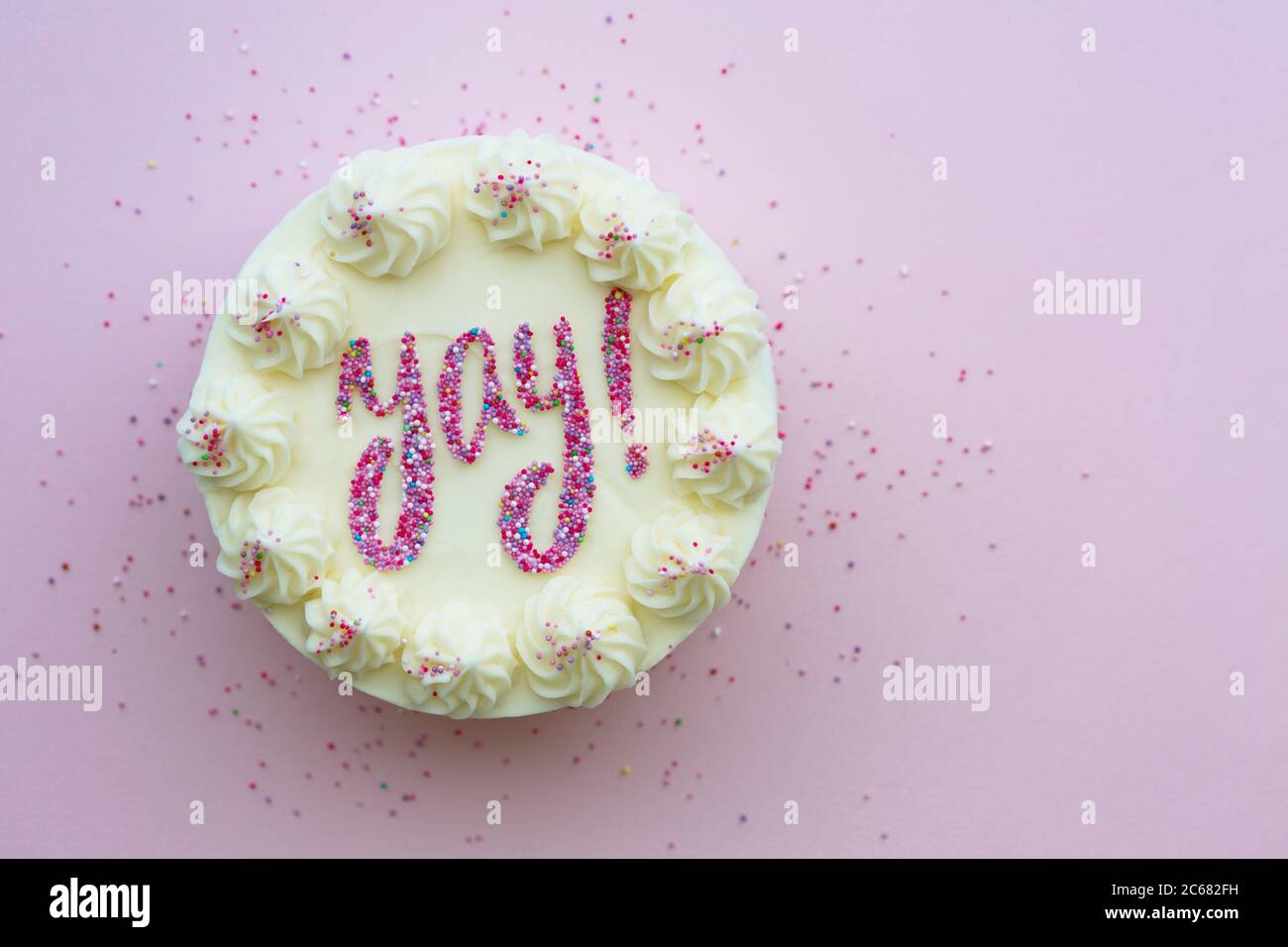 Birthday cake with yay written in colorful sprinkles Stock Photo - Alamy