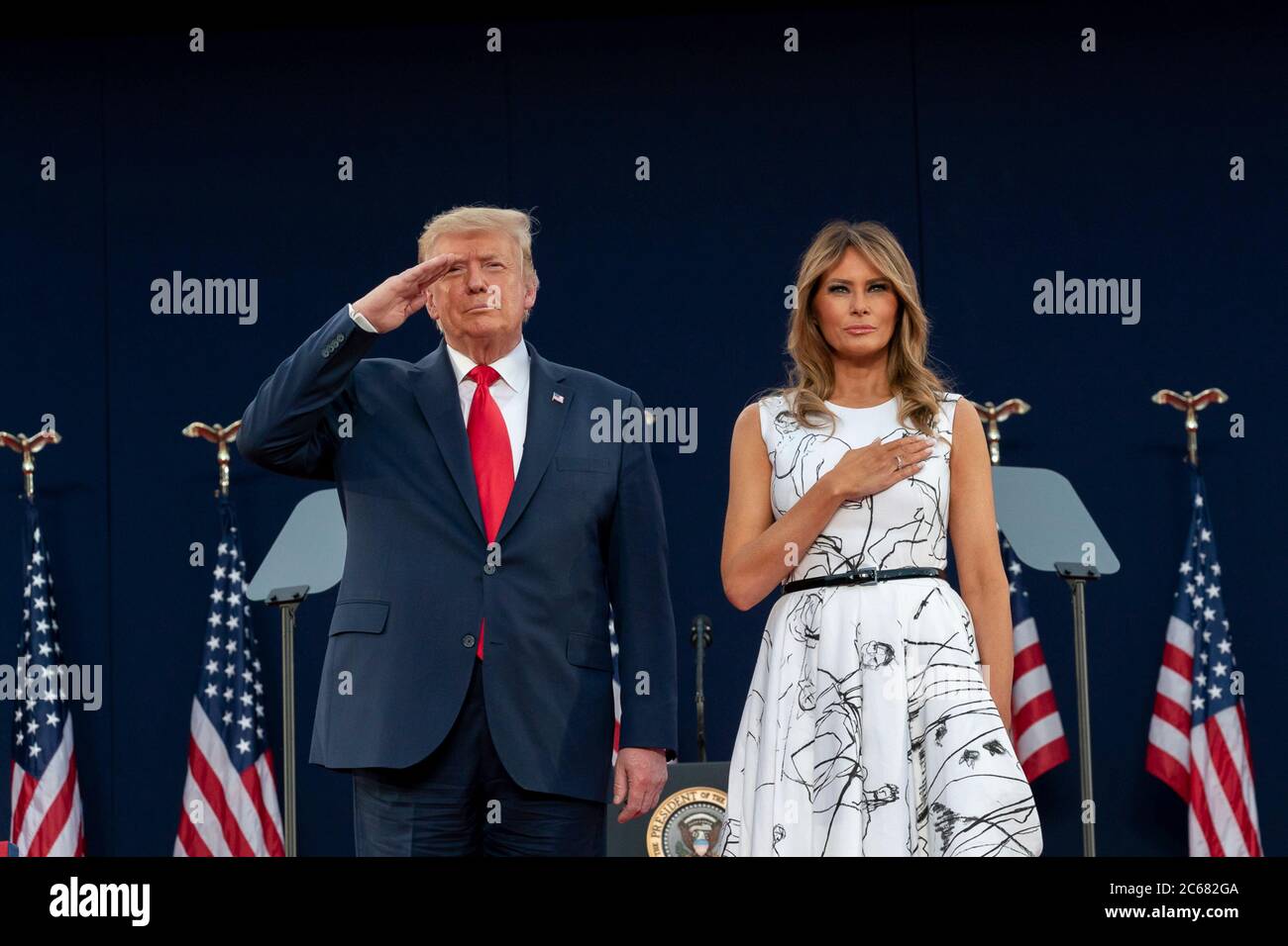 U S President Donald Trump And First Lady Melania Trump Stand For The