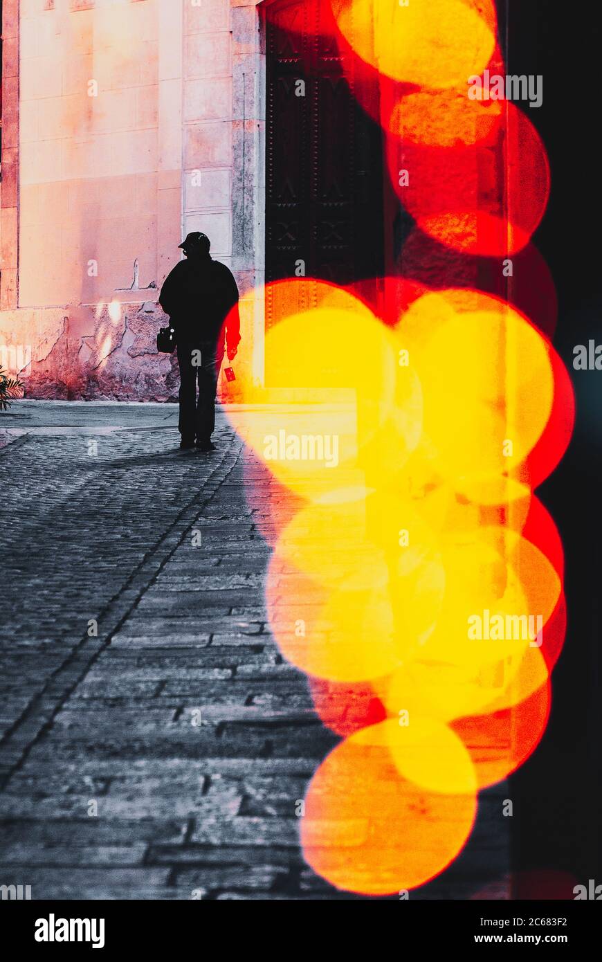 Man walking down back alley hi-res stock photography and images - Alamy