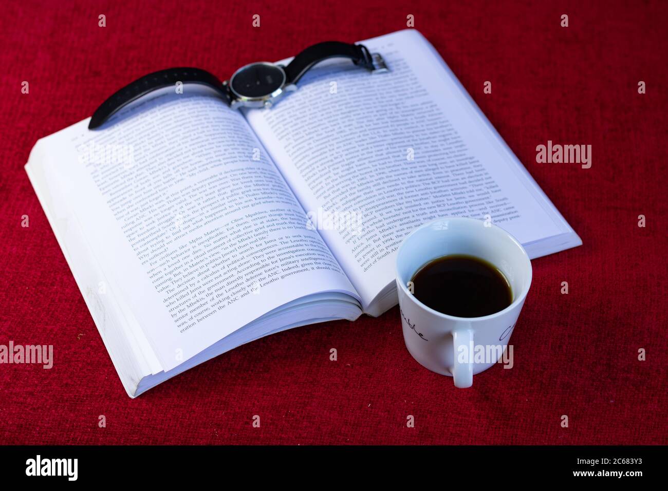 Coffee, with an open book Stock Photo - Alamy