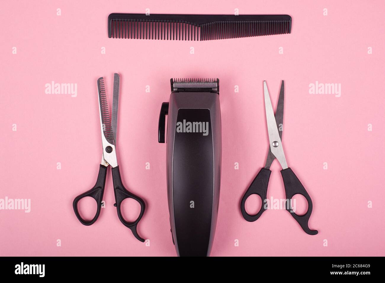 barber tool kit on a pink background Stock Photo - Alamy