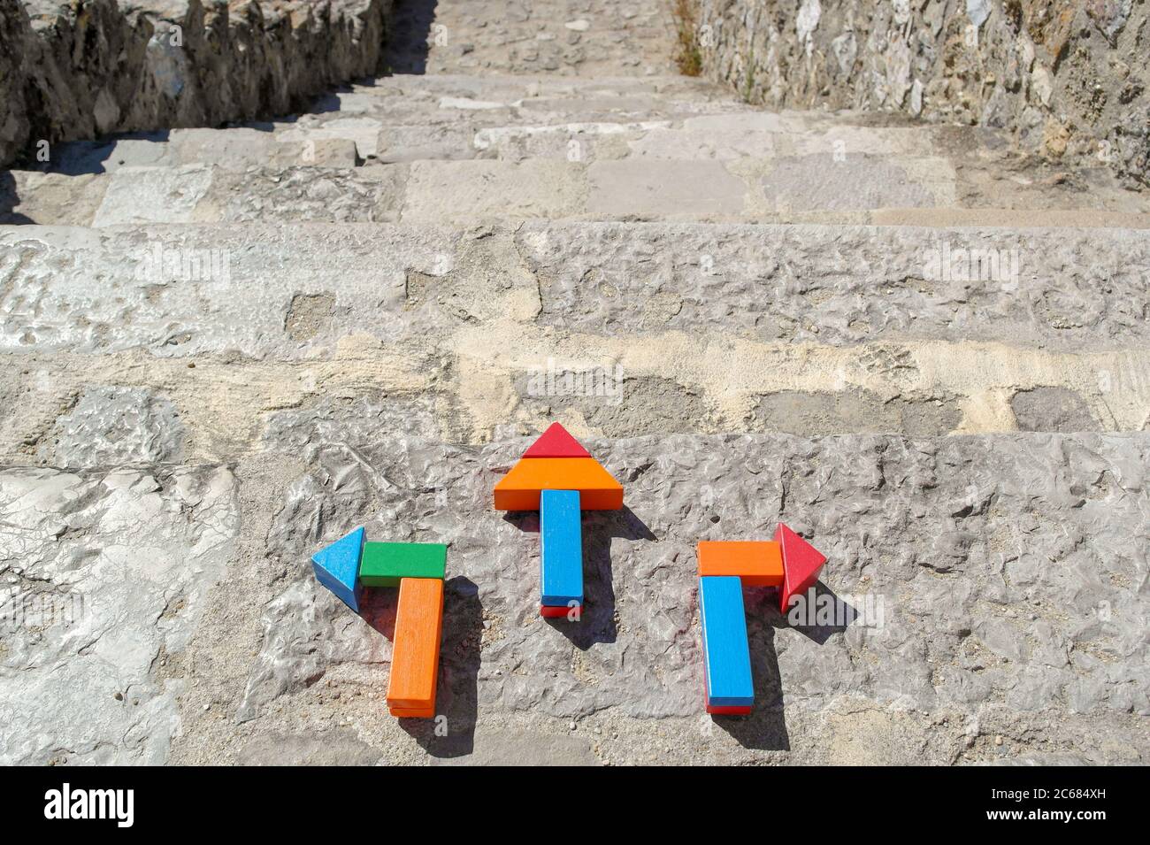 Detail of some arrows with a stone wall background Stock Photo - Alamy