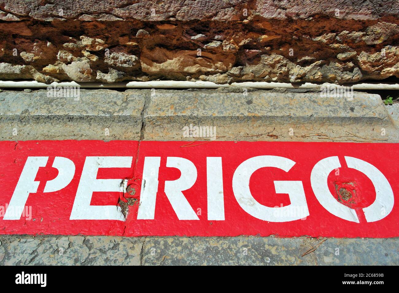Danger, Perigo sign with stone background Stock Photo - Alamy