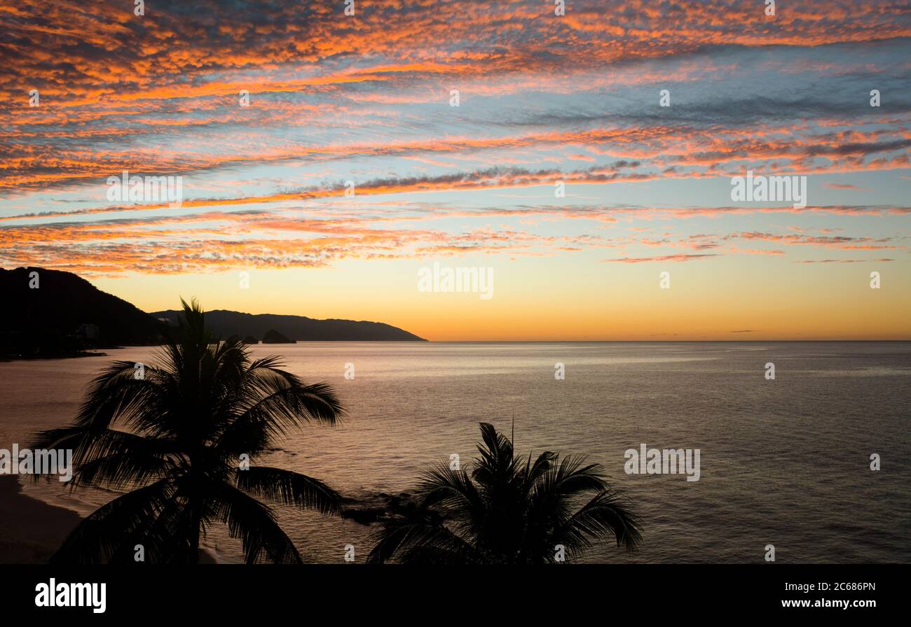 View of sunset over Punta Negra Beach, Puerto Vallarta, Jalisco, Mexico ...