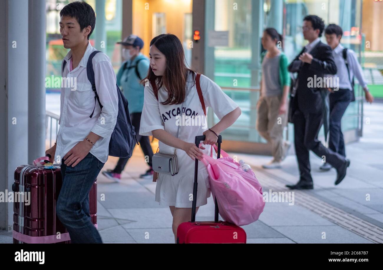 Commuters walking quickly in the interior section of Tokyo Railway ...