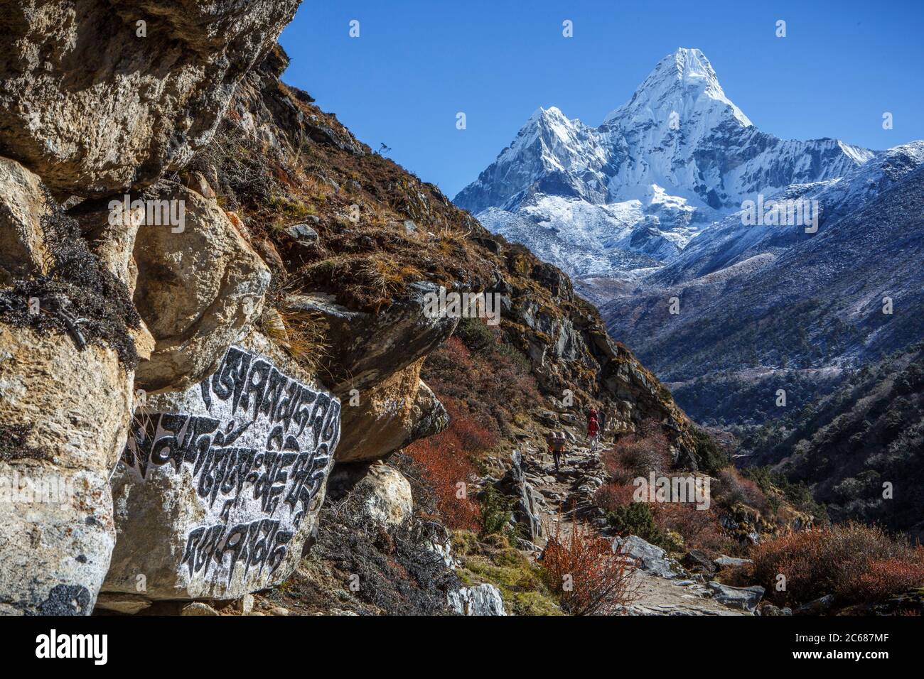 Buddhist script below the peak of Ama Dablam on the trail to Everest ...