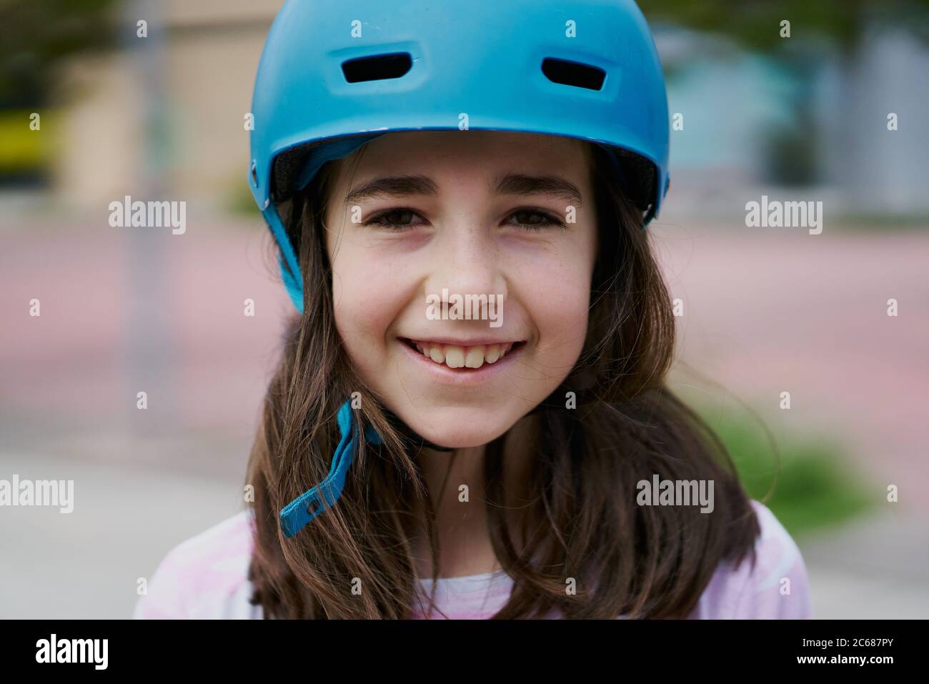 portrait of girl with blue helmet Stock Photo - Alamy