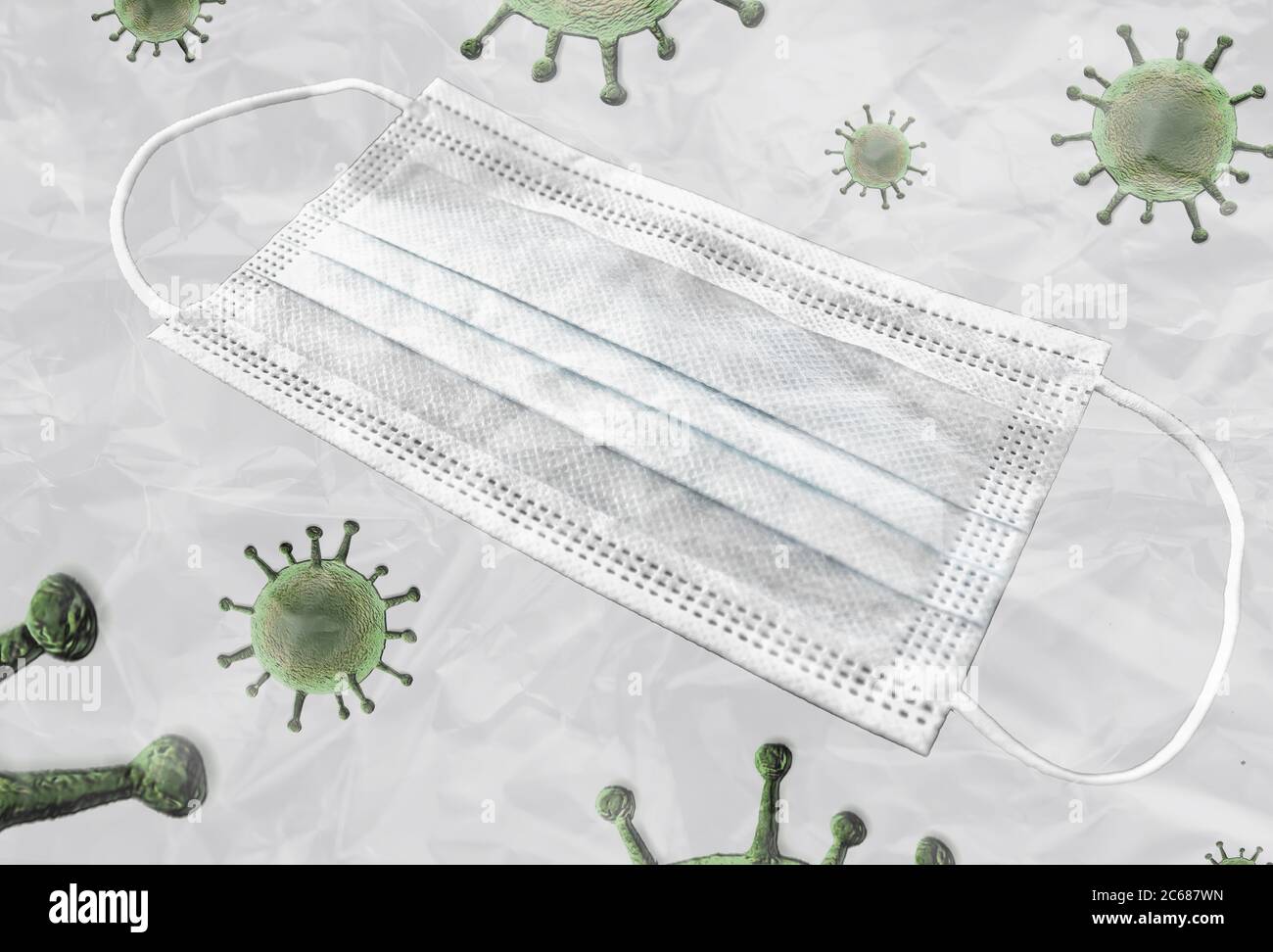 Medical corona virus mask behind plastic film with corona virus on and ...