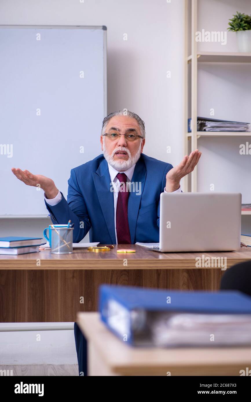Male boss employee working in the office Stock Photo - Alamy