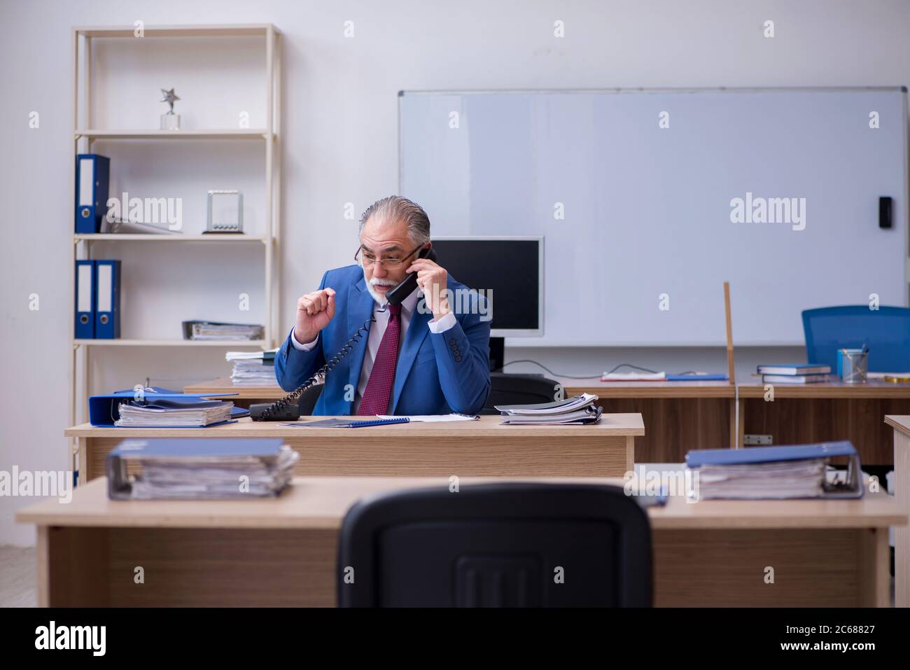 Male boss employee working in the office Stock Photo - Alamy