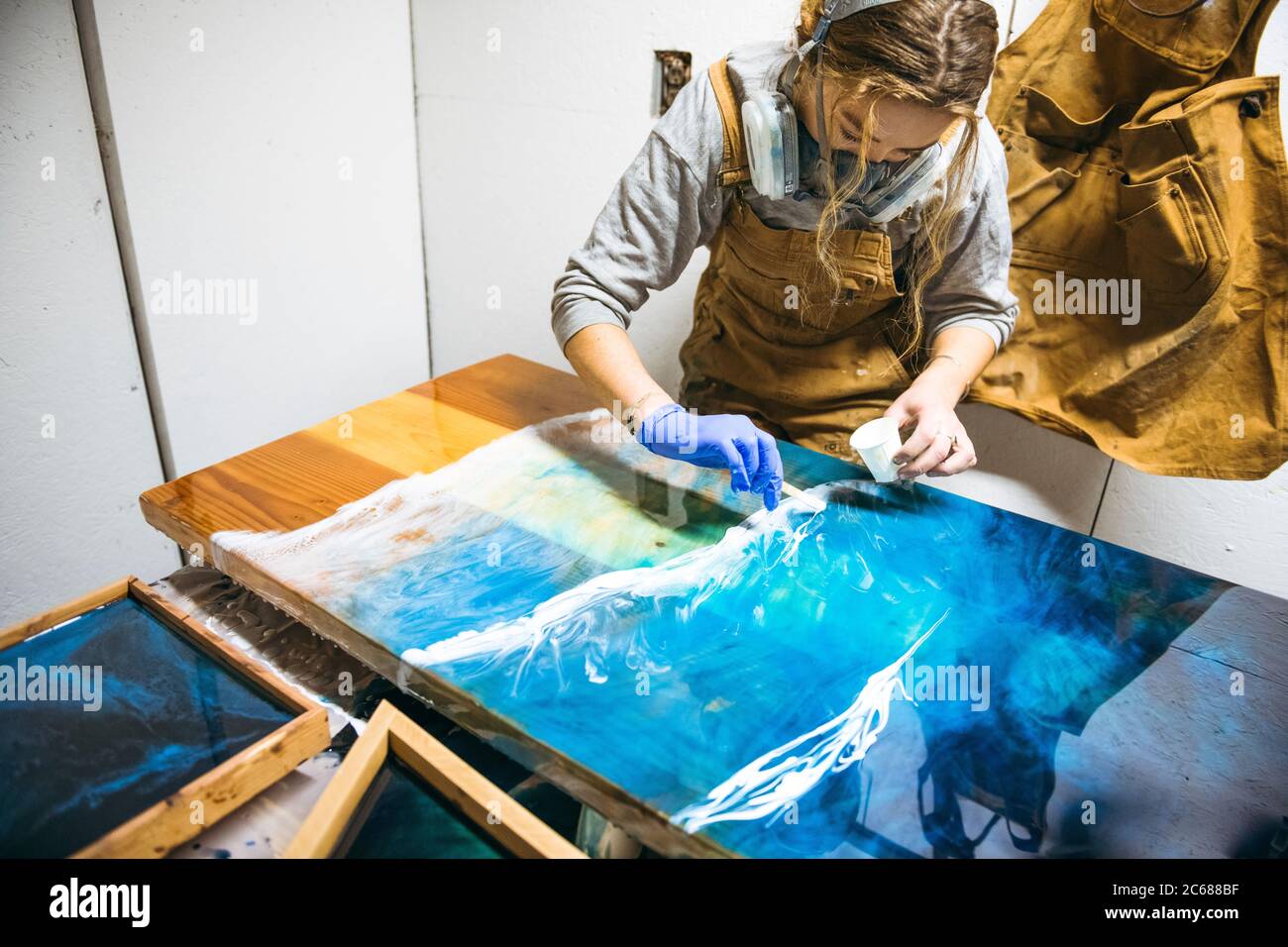 Female resin working in homemade studio Stock Photo - Alamy