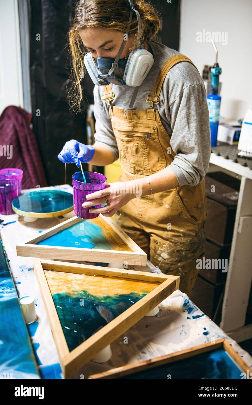 Female resin working in homemade studio Stock Photo - Alamy