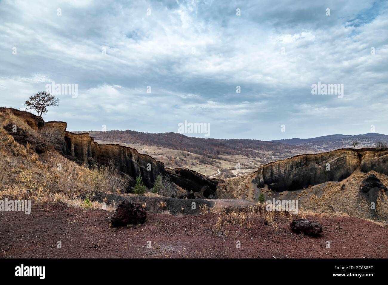 Red slag RacoÈ™ Volcano in Romania Stock Photo - Alamy