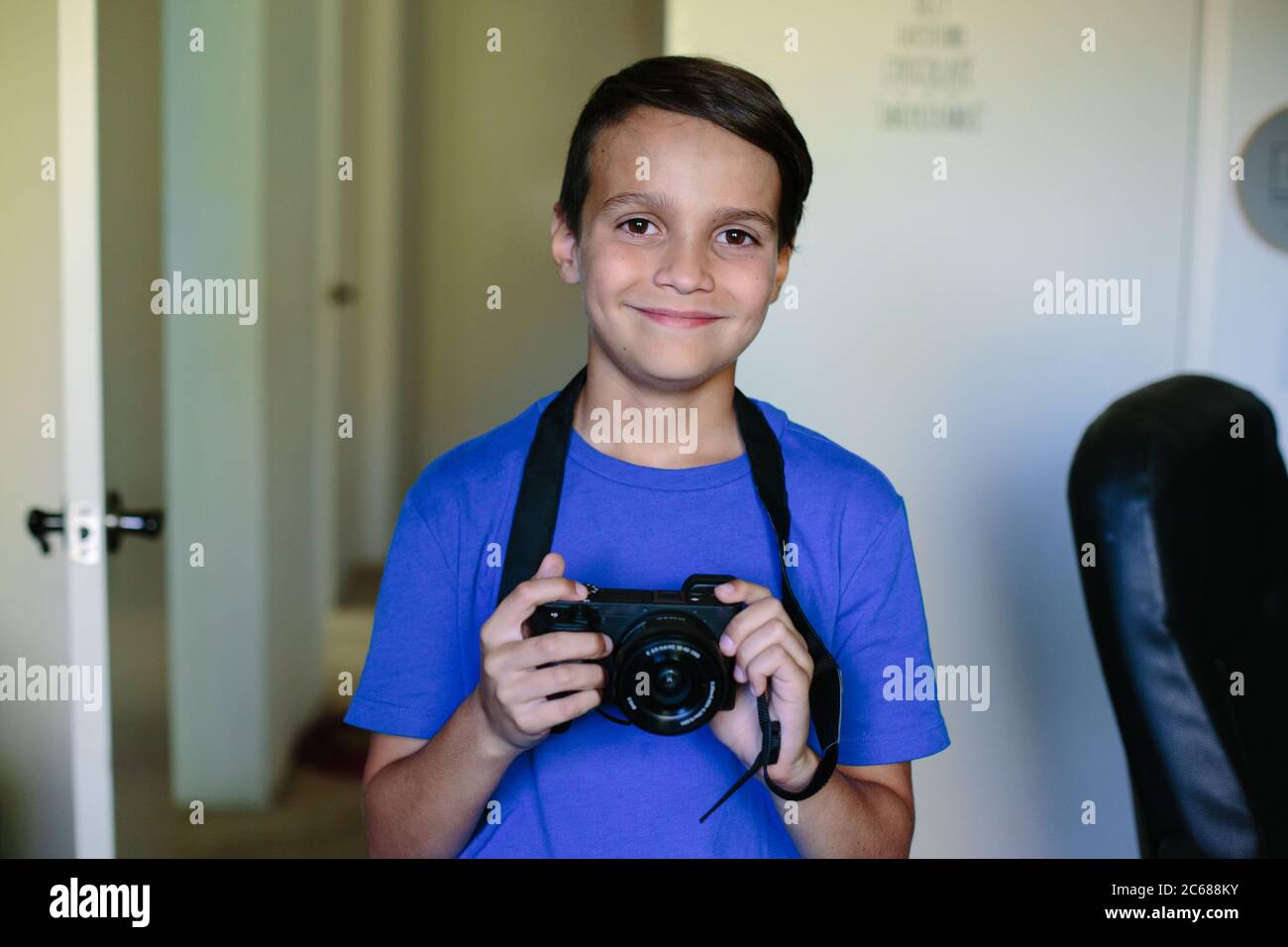 Boy in a blue shirt hi-res stock photography and images - Alamy