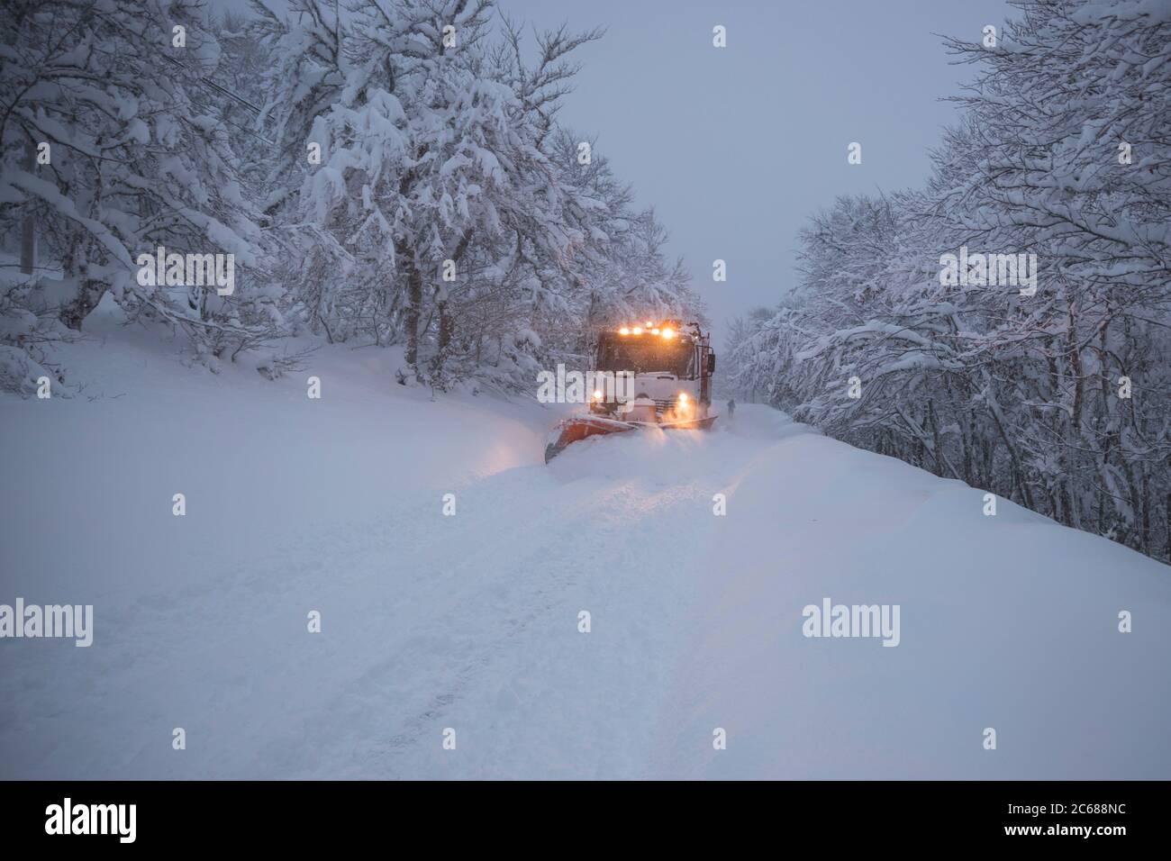Snow blower working hard in high mountain Stock Photo - Alamy