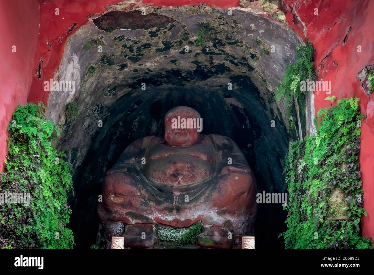 Leshan, China - July 2019 : Small Buddha figure shrine in a smal cave ...