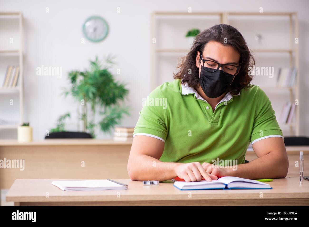 Young man student studying at the home in self-isolation concept Stock ...