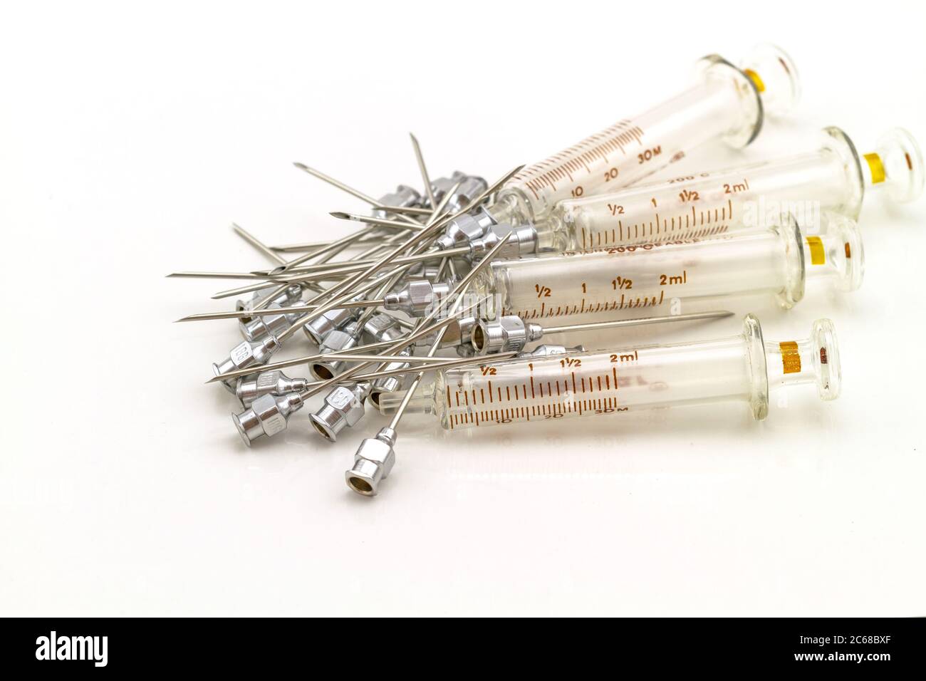 Stack of reuse iron needle No.18 G for drug needle and glass syringe on ...