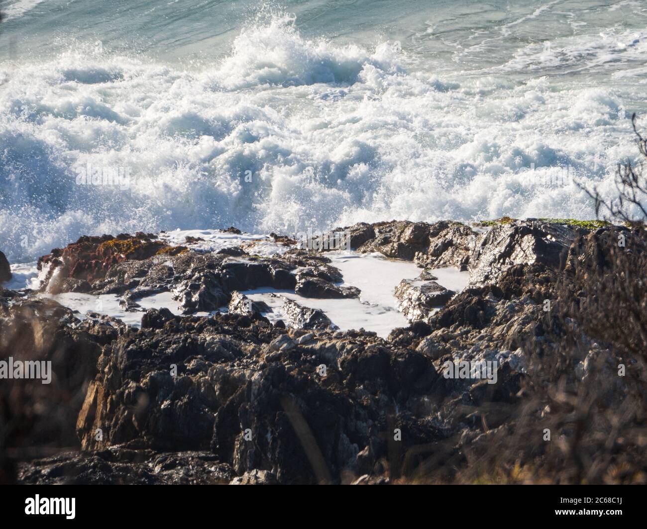 waves crashing over rocks Stock Photo - Alamy