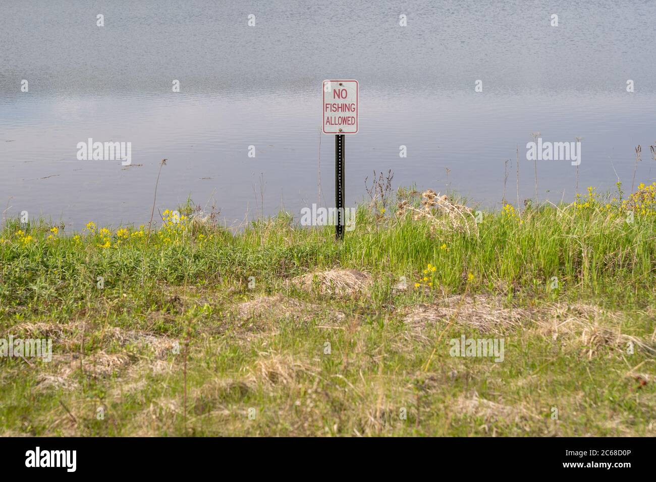 No fishing allowed sign near a lake. Taken in the Arbor Lakes area of ...