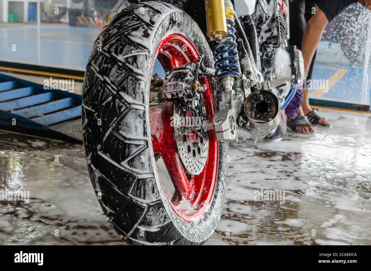 Bubble foam cleaning motorcycle wash Stock Photo - Alamy